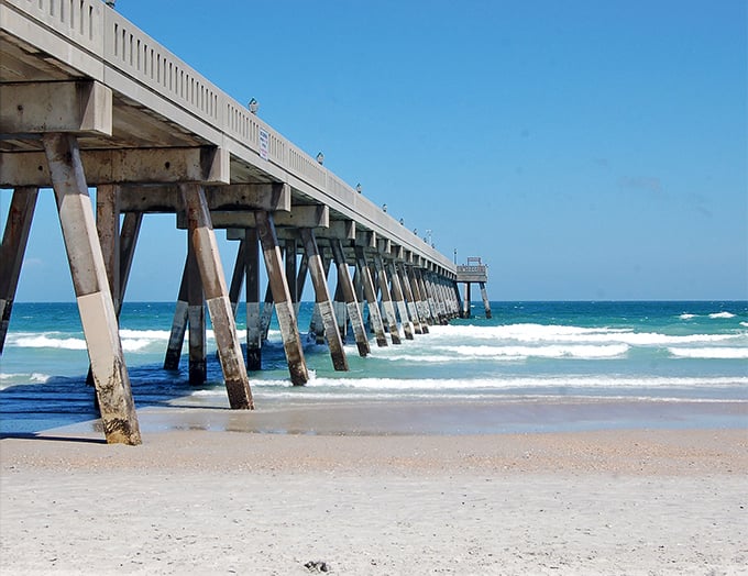 The Wrightsville Beach pier stretches toward the horizon like a runway to paradise, inviting you to walk above the waves.