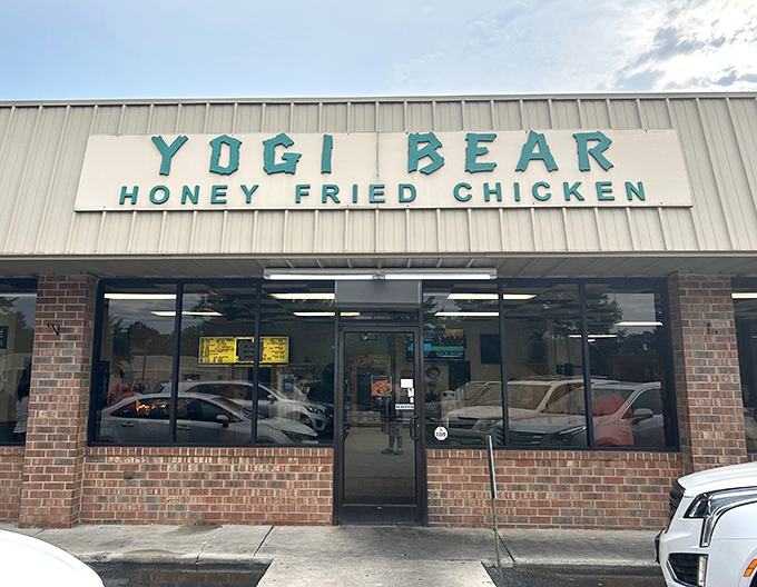 The unassuming storefront of Yogi Bear Honey Fried Chicken hides culinary magic that would make even Boo-Boo abandon his picnic basket.