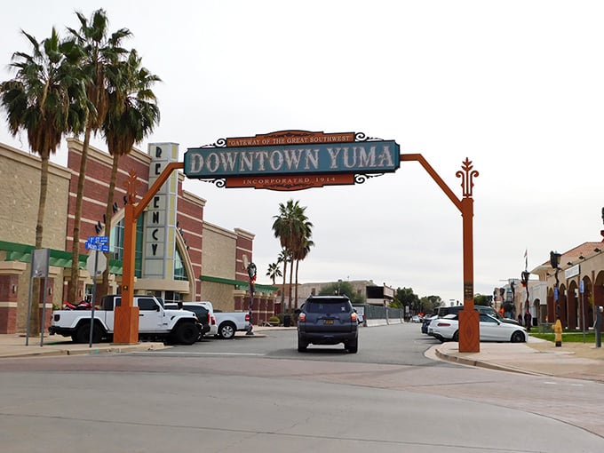 Downtown Yuma welcomes visitors with its iconic arch and palm trees, a sunny gateway to Arizona's most affordable retirement haven.