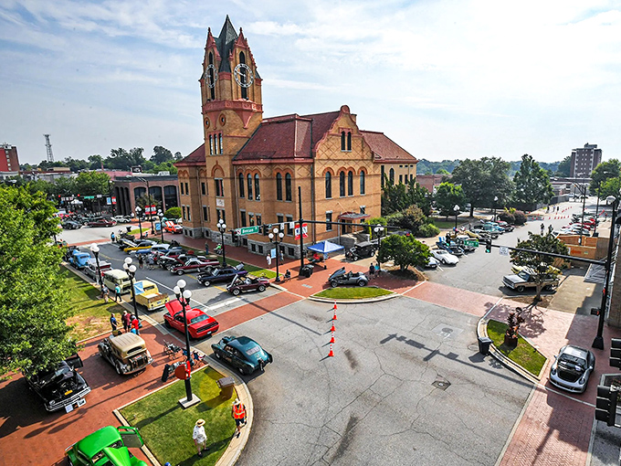"Classic cars gather around Anderson's grand courthouse like colorful beetles at a picnic. Small-town America showing off its Sunday best."
