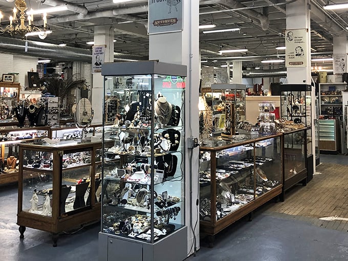 Vintage jewelry heaven! These glass cases are like time capsules where your grandmother's favorite brooch might be hiding.