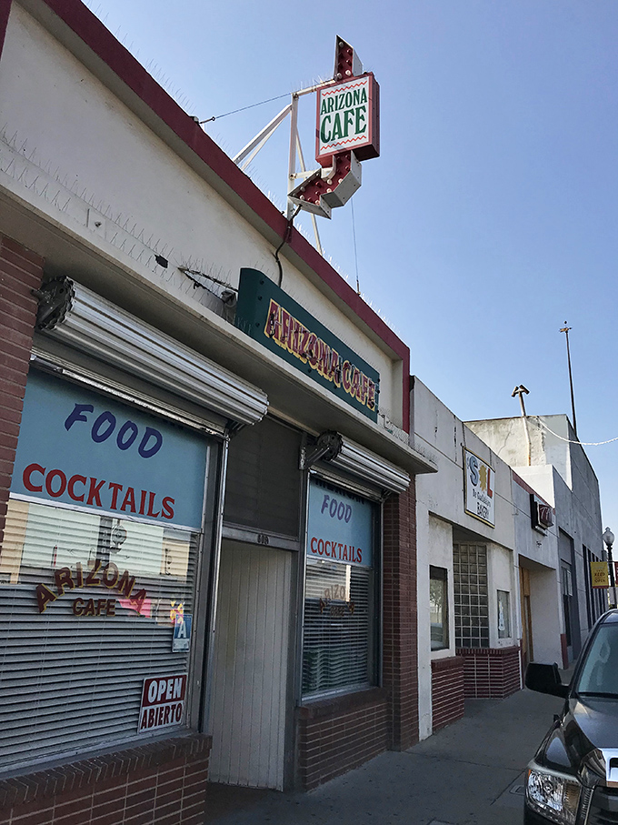 That vintage neon sign has been calling hungry souls to authentic Mexican comfort for generations. 