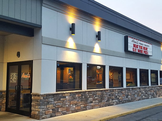 Evening at Arni's &ndash; where the glowing windows and stone facade hint at the pizza paradise waiting inside.