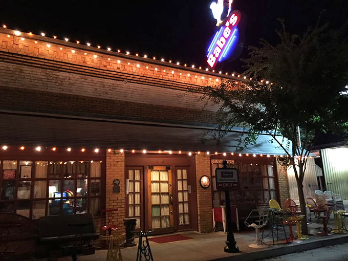 Night falls, but chicken calls! The warm glow of those string lights promises comfort food that'll make you forget your diet resolutions.