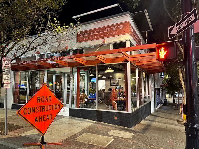 Night falls, but Beasley's glows like a honey-drizzled beacon. That red awning promises chicken dreams that'll haunt you in the best way possible.