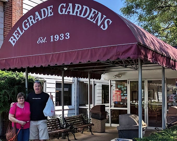 Step into chicken history! Belgrade Gardens' entrance welcomes hungry visitors with its classic red awning and promise of crispy perfection.