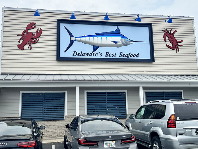 The twin red crabs flanking that marlin sign? They're practically waving you in for a seafood feast that'll make your day.