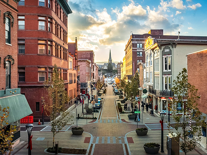 Sunset casts a golden glow on Cumberland's downtown, where historic buildings stand shoulder to shoulder like old friends catching up.