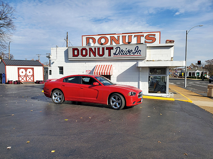 The red Charger meets the red awning. Two American classics parked at a St. Louis institution where time stands deliciously still.