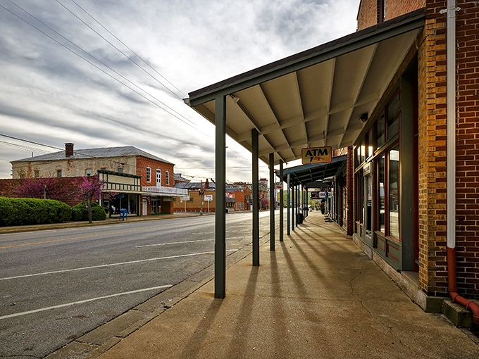 Covered sidewalks invite leisurely strolls through Hermann's historic heart, where every storefront holds yesterday's charm.