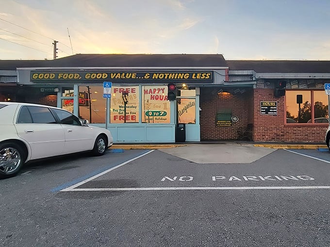Sunset at Manny's &ndash; where happy hour meets happy stomachs. That neon glow is like a beacon for steak lovers.