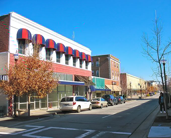 Red and blue awnings pop against classic storefronts in downtown Martinsville. This is Main Street as it should be&mdash;inviting, walkable, and full of local character.