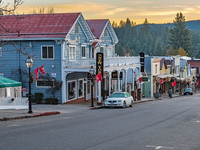 Sunset bathes Nevada City's historic buildings in golden light. Even the street lamps seem to whisper stories from another era.
