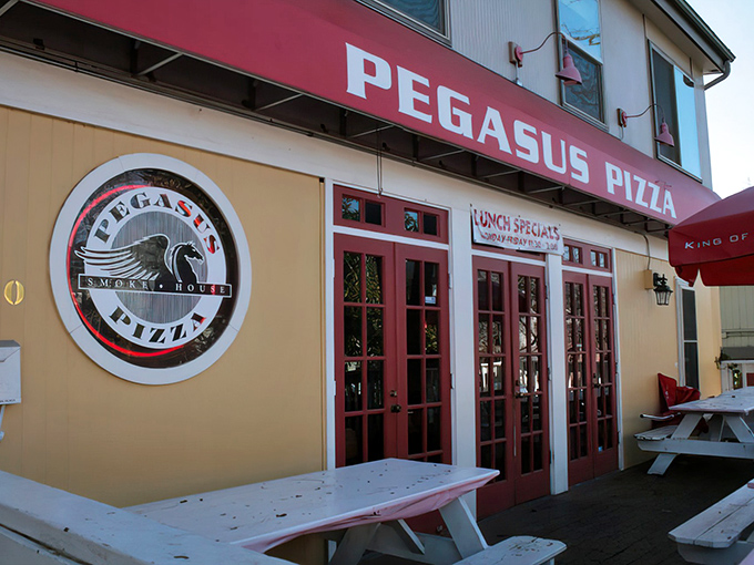 That circular logo promises what awaits inside: smoky, heavenly pizza that would make the mythical Pegasus himself swoop down for a slice.