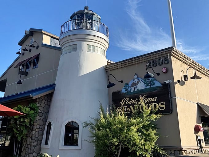 Blue skies frame Point Loma Seafoods' iconic white lighthouse tower. This nautical gem has been guiding hungry sailors to seafood nirvana for generations.