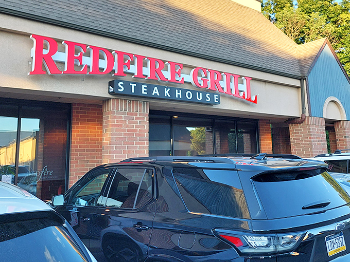 That iconic red sign beckons to carnivores like a lighthouse to sailors. Your steak adventure awaits!