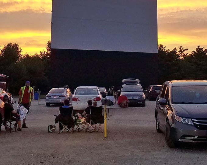 Sunset at South Drive-In creates that perfect golden-hour glow. Families setting up chairs between cars&mdash;modern tailgating with a Hollywood twist!