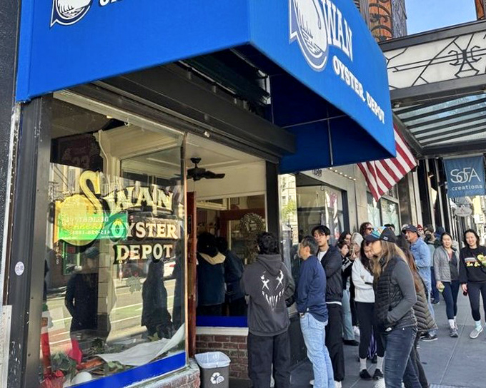 Blue awning, American flag, and a crowd of hungry patrons&mdash;Swan Oyster Depot's exterior promises seafood treasures worth the wait.