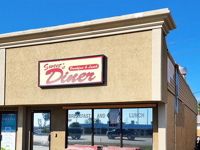 The classic red and white signage at Sweet's promises exactly what hungry souls crave most.