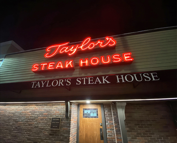 Behind this unassuming brick entrance lies a temple of meat that would make even vegetarians pause for reflection.