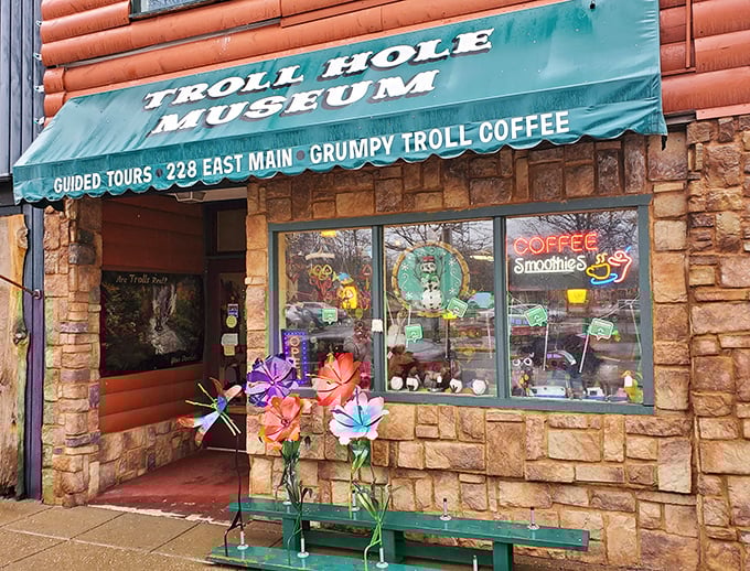 The Troll Hole Museum storefront promises coffee and curiosities. Those colorful flowers might just be trolls in disguise!