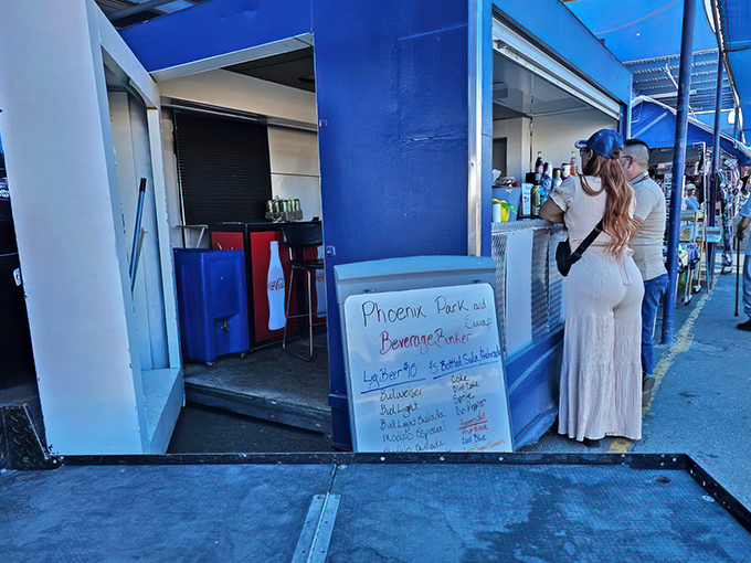 The beverage stand's handwritten menu offers respite from the desert heat, with horchata and aguas frescas beckoning thirsty treasure hunters.