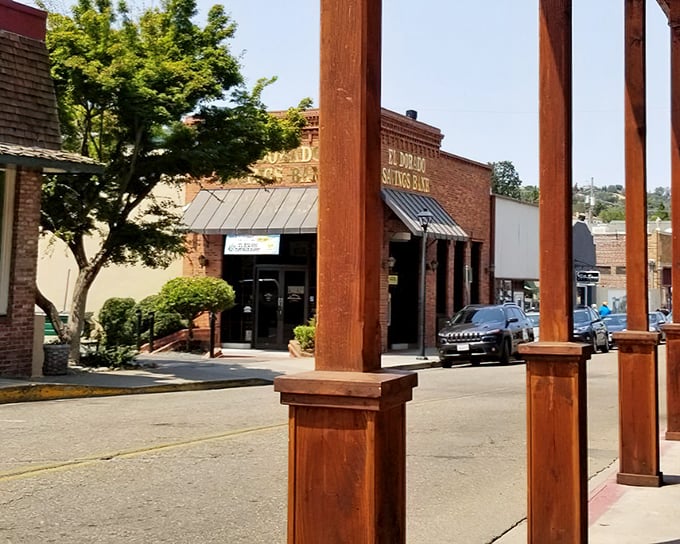 Wooden pillars frame a glimpse of old-town Jackson, where brick buildings have witnessed generations of dreamers, schemers, and everyday folks.