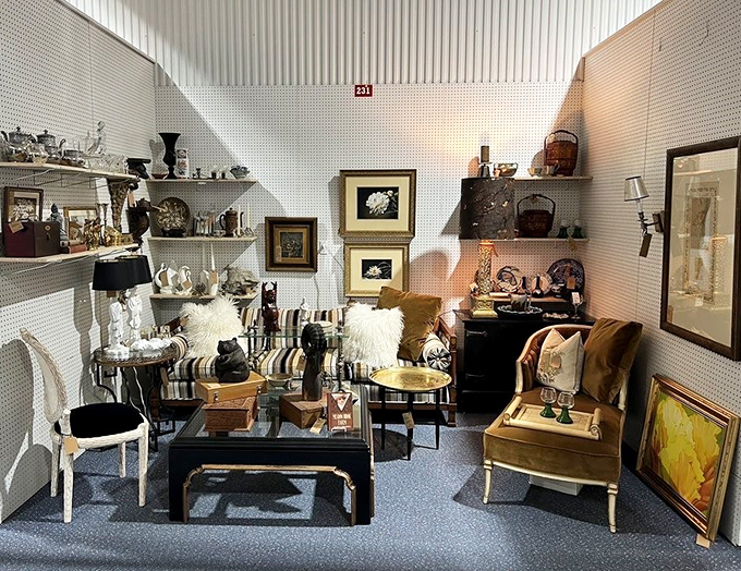 Elegantly curated vendor spaces transform shopping into time travel. This booth's mid-century furniture would make Don Draper feel right at home.