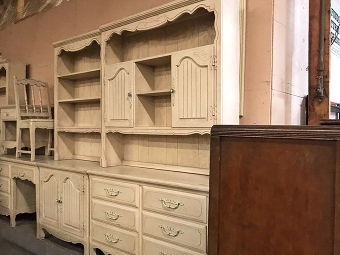 Vintage furniture with stories to tell. These cream-colored cabinets have probably witnessed more family dinners than most wedding caterers.