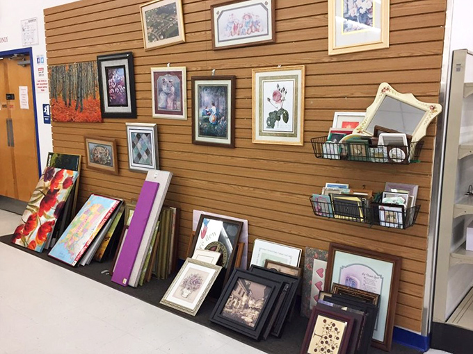 Wall-to-wall artwork awaits new homes. One person's "what was I thinking?" becomes another's conversation starter.