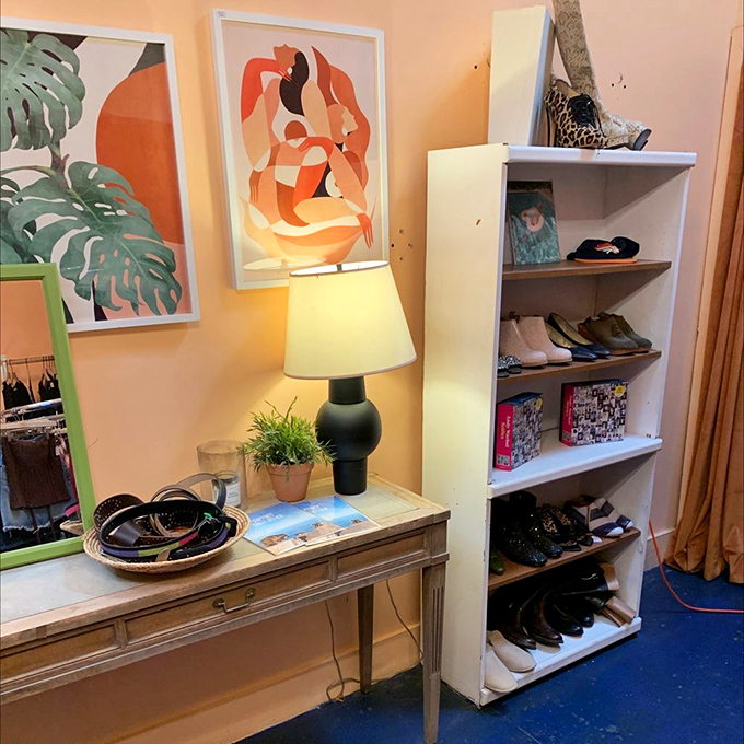 Modern art meets vintage charm in this corner display. Who knew secondhand shopping could feel like visiting a boutique gallery?