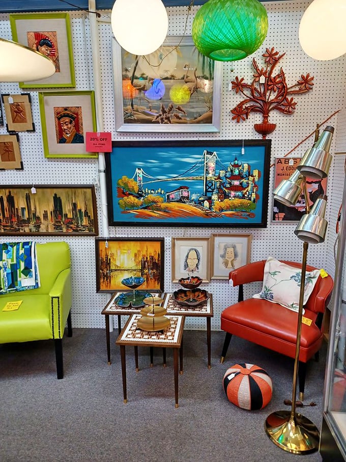Mid-century modern meets artistic flair in this carefully curated booth. That lime green chair is practically begging to become someone's conversation starter!