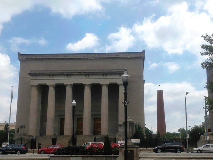 The stately Baltimore War Memorial provides an architectural counterpoint to the Shot Tower's industrial might. Two different chapters of American history having a silent conversation.