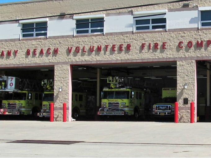 Even emergency services get the beach treatment here. Bethany's lime-green fire trucks stand ready in their sun-washed headquarters, coastal protection with a splash of color.