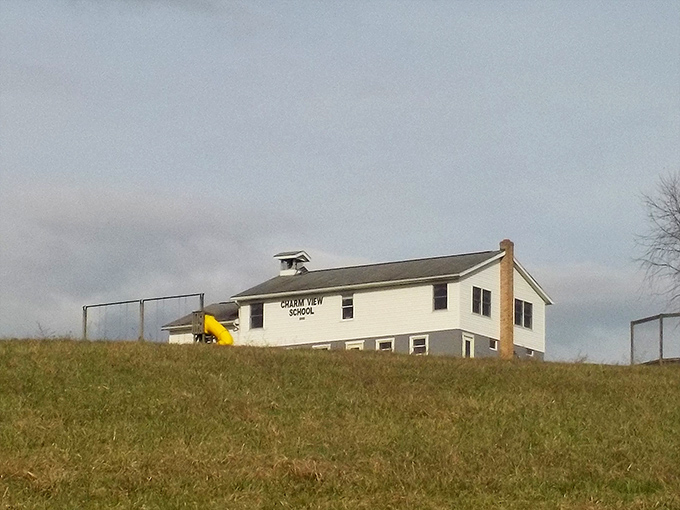 Charm View School stands as a testament to simplicity—no smartphones, no tablets, just the fundamentals of education against Ohio's rolling hills.