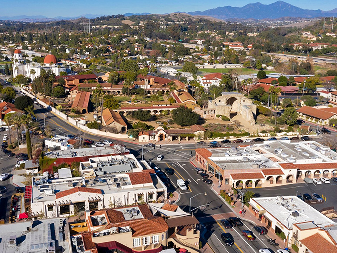 From above, San Juan Capistrano reveals itself as a terracotta dream nestled between mountains and modern life.