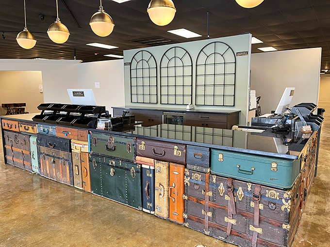 Not your average checkout counter! These vintage suitcases stacked together create a reception area that's already telling stories before you've bought anything.