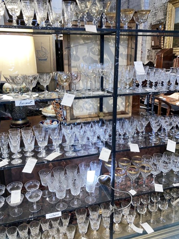 Crystal kingdom where Gatsby would've shopped. Each glass waiting to catch the light and tell stories of champagne toasts and dinner parties from another era.