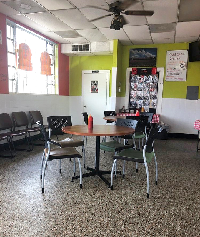 Lime green walls and no-nonsense seating tell you immediately: this place prioritizes what's on your plate, not what's on their walls.