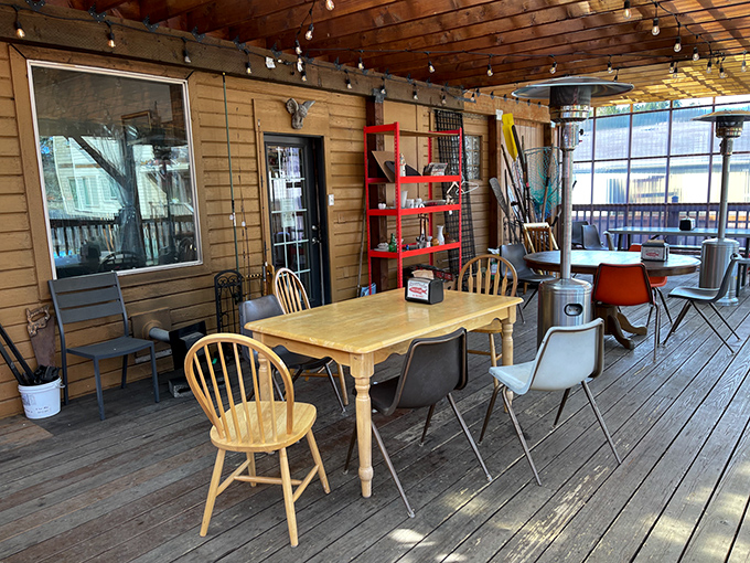 Mismatched chairs and string lights create that "friend's beach house" vibe where memories are made between bites of perfectly fried fish.