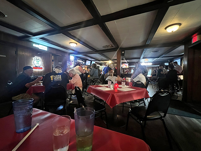 Friday nights transform this wood-paneled dining room into a bustling community hub where red tablecloths signal serious comfort food territory.