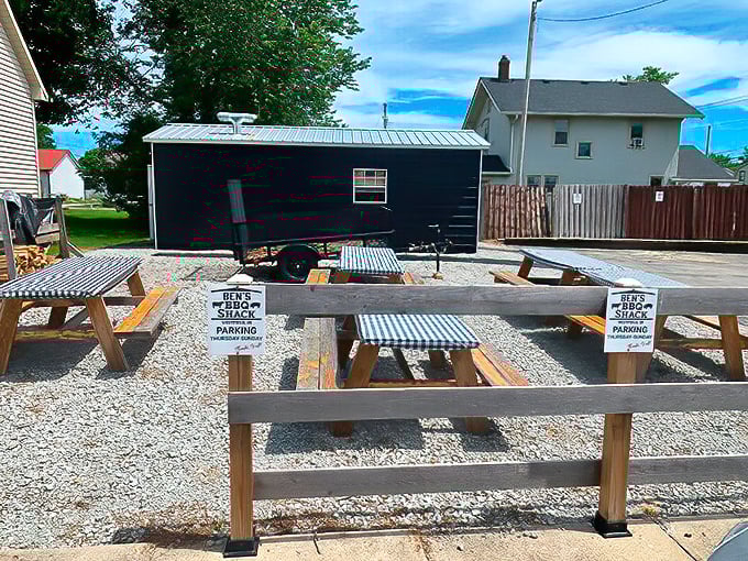 Picnic tables and a serious smoker—the outdoor dining setup at Ben's proves that sometimes the best restaurant ambiance is simply fresh air and anticipation.