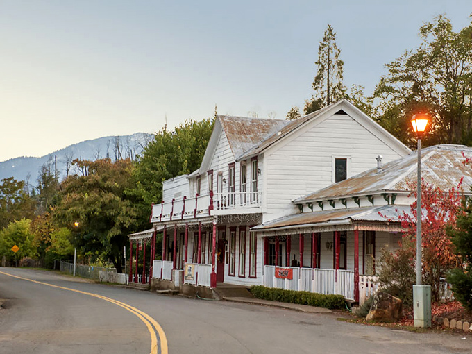 Sunset casts a golden glow on the historic French Gulch Hotel, where the front porch practically begs you to sit a spell and watch the world slow down.