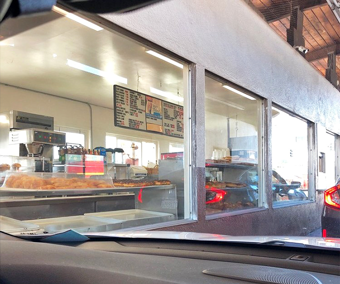 Where dreams come true, one window at a time. That magical moment when you exchange cash for fresh donuts without ever leaving your car&mdash;modern convenience meets old-school indulgence.