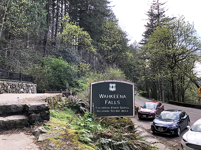 The unassuming entrance sign belies the grandeur waiting just beyond, like finding the door to Narnia in an ordinary wardrobe.