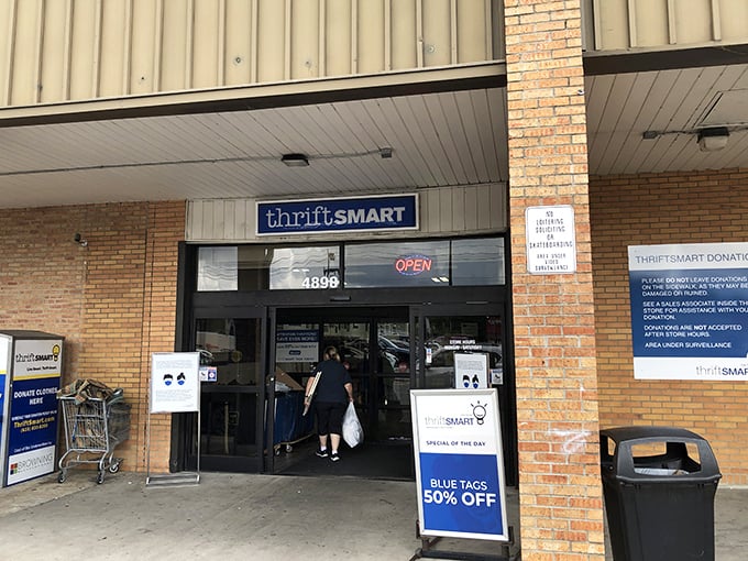 The entrance beckons with promises of blue tag specials, where everyday shoppers transform into modern-day treasure hunters.