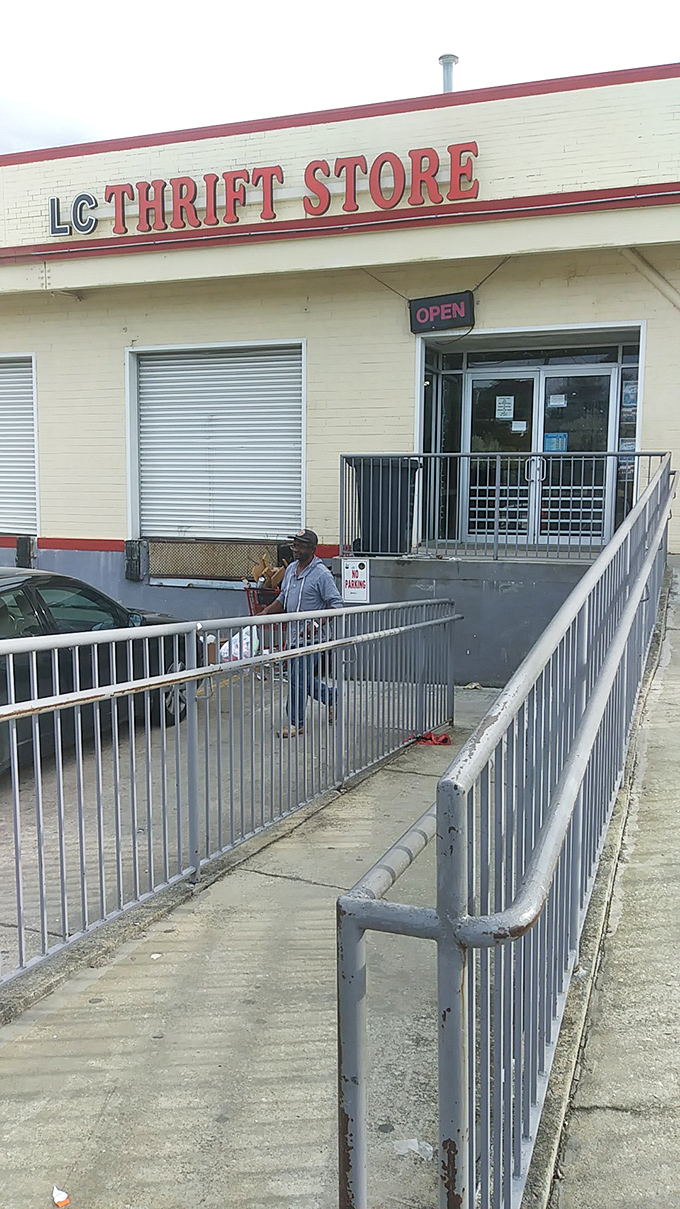 The entrance beckons with its simple "OPEN" sign – like a portal to parallel universes where yesterday's castoffs become tomorrow's conversation pieces. P