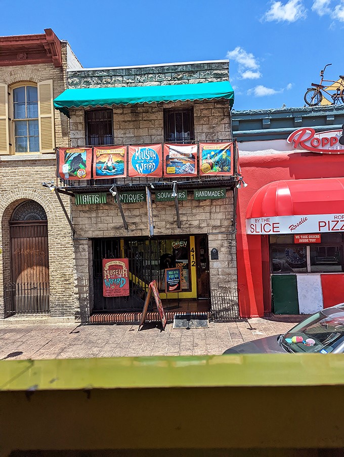 Sandwiched between normal Austin businesses, this unassuming stone building houses some of the strangest sights you'll ever encounter. Pizza on the right, nightmares on the left.