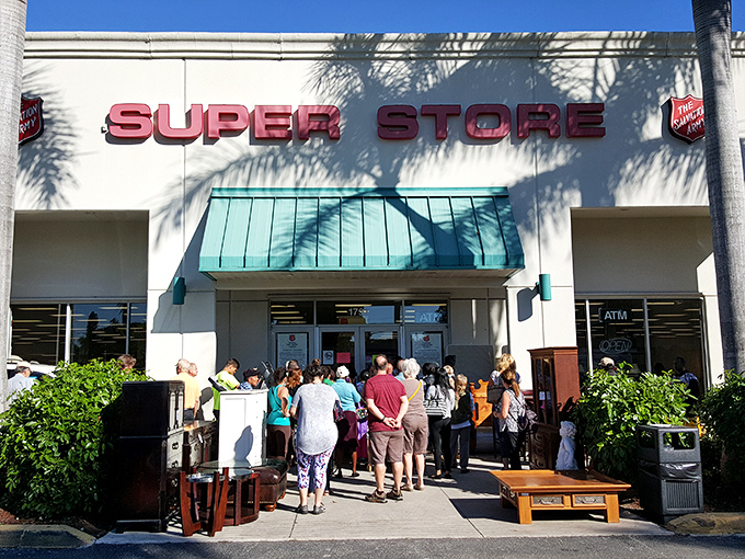 The red "SUPER STORE" sign isn't just marketing&mdash;it's truth in advertising. Note the eager shoppers already lining up for their bargain safari.