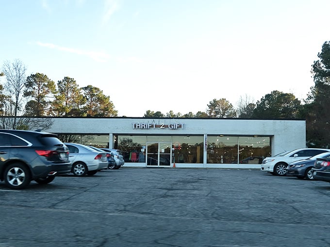 Morning sunshine bathes Thrift2Gift in golden light, turning this thrifting destination into a beacon for bargain hunters. The parking lot already shows signs of eager shoppers.